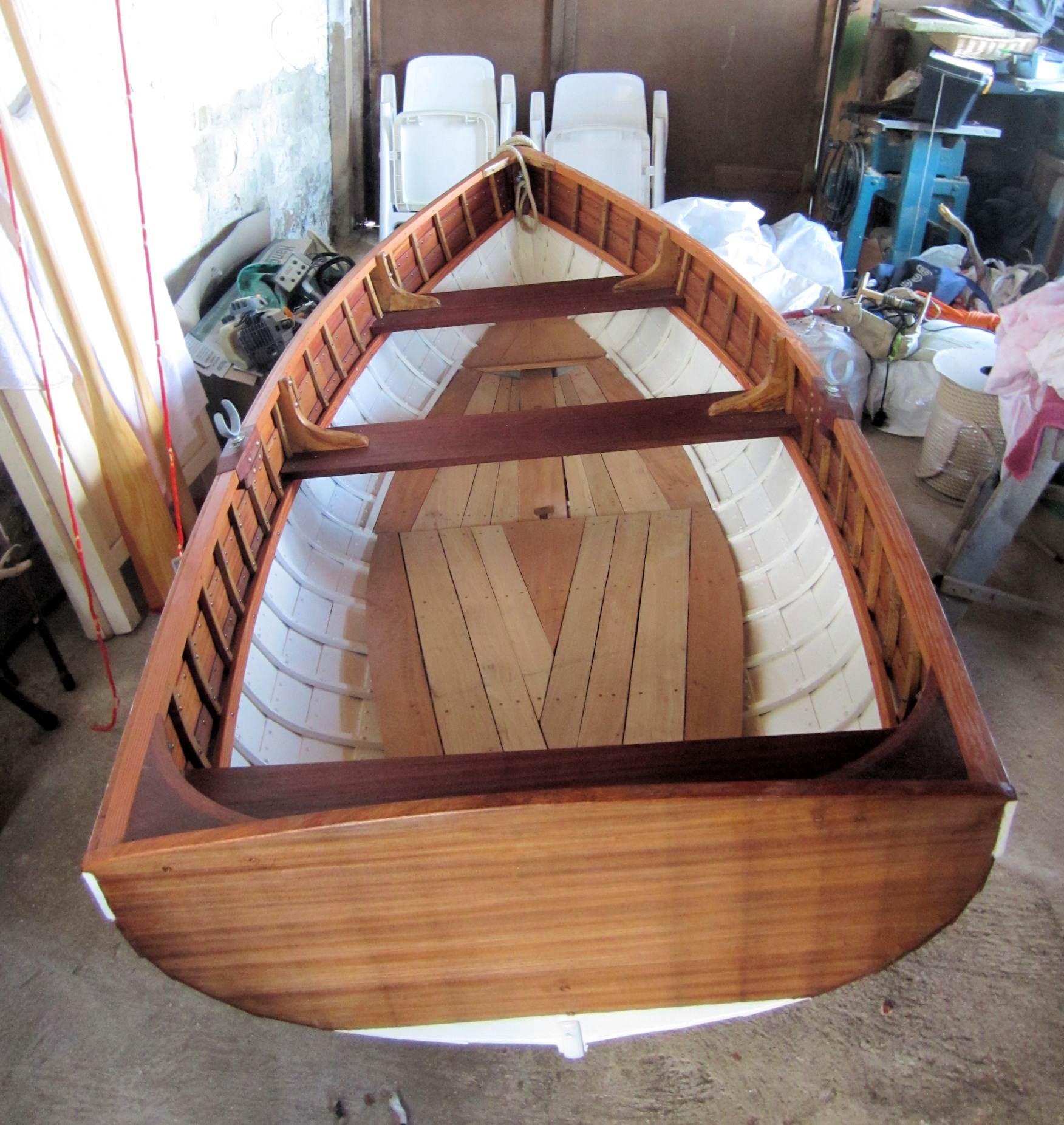 Newly built traditional wooden clinker rowing boat