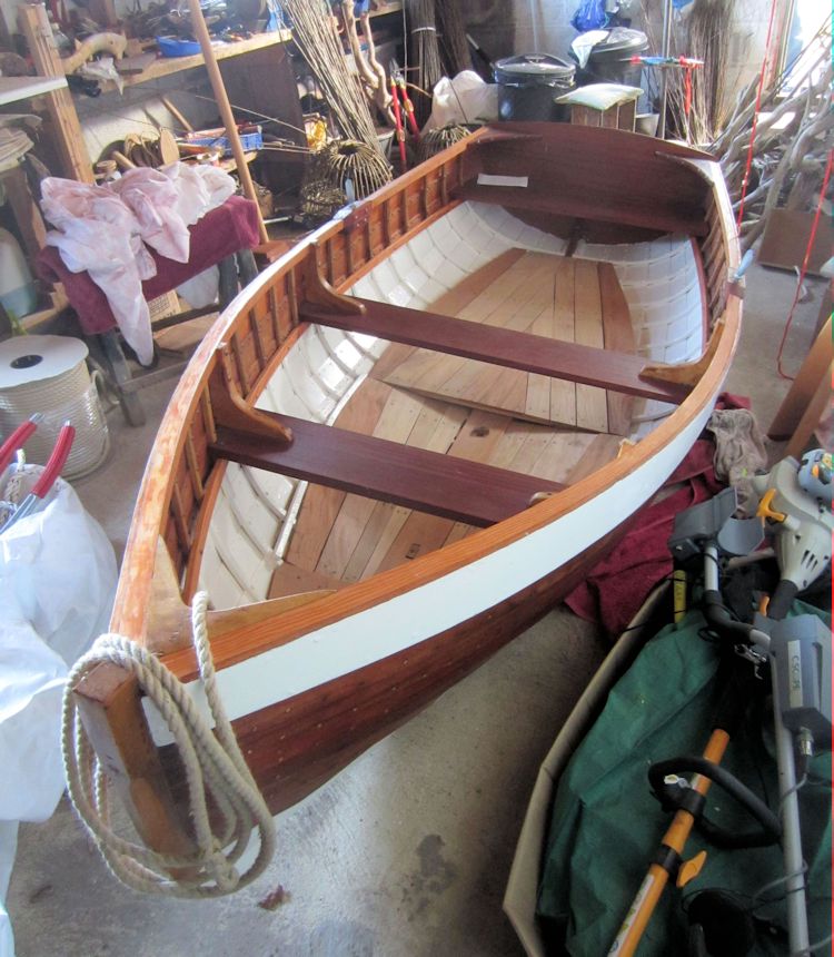 Newly built traditional wooden clinker rowing boat